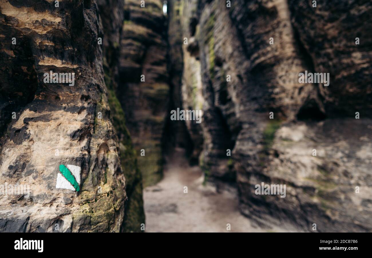 Rock sandstone with signs for use in the field. A sign that lines a ...