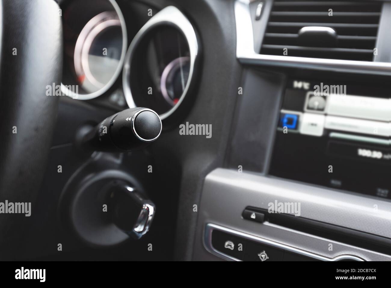 Close-up of a black plastic control panel with ignition switch and ...