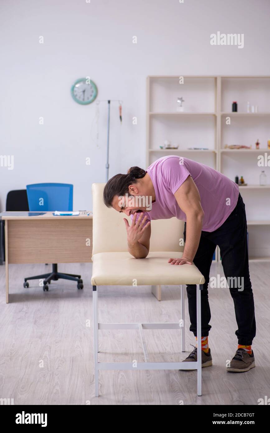 Male patient waiting for doctor in the clinic Stock Photo - Alamy