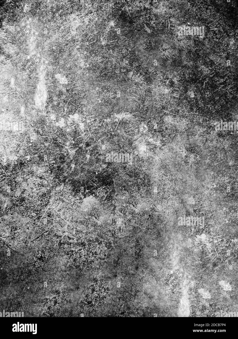 Stone base of the wall with a rough textured surface of dark color ...