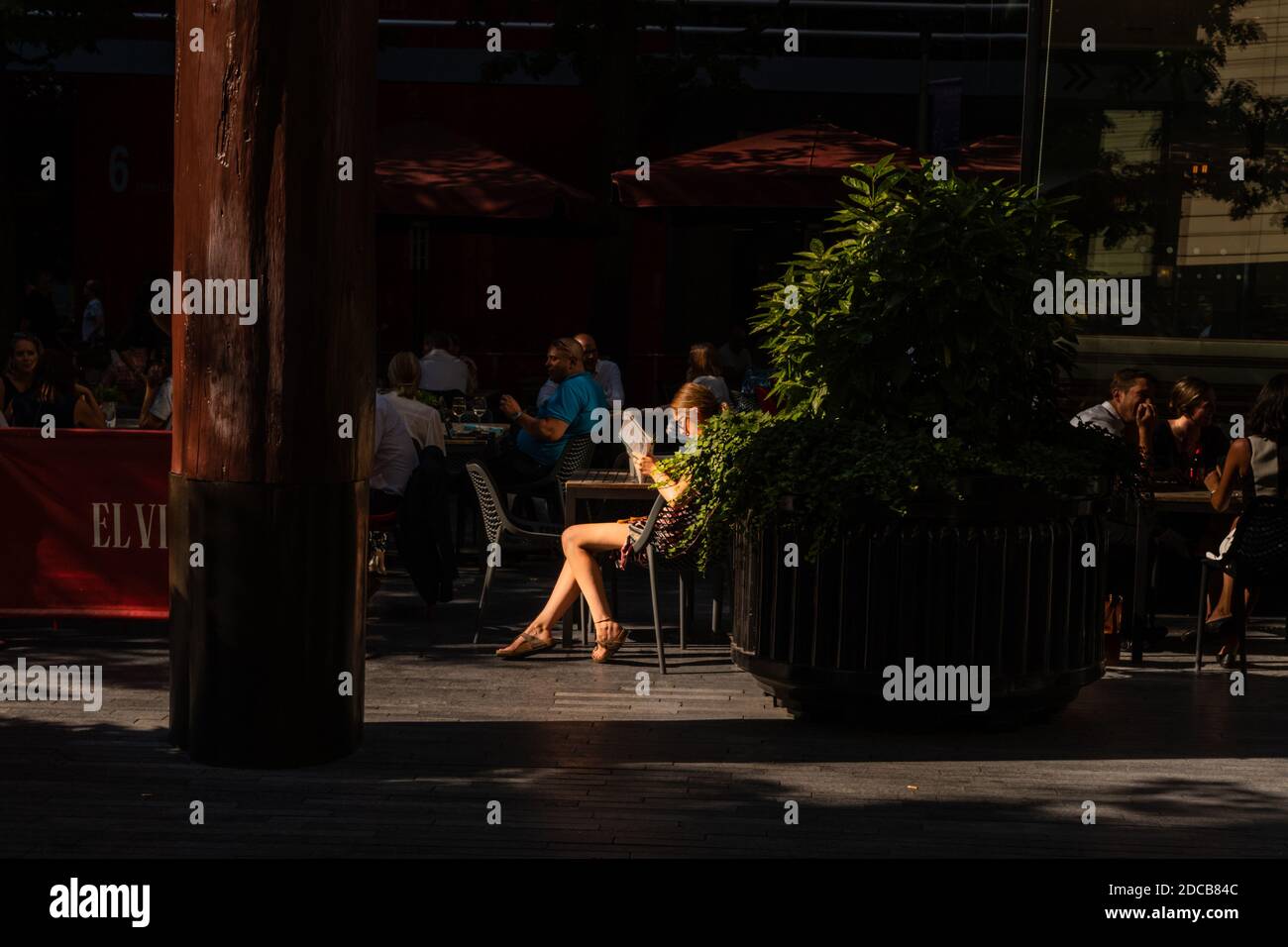 Girls legs lit by sun in London Stock Photo - Alamy