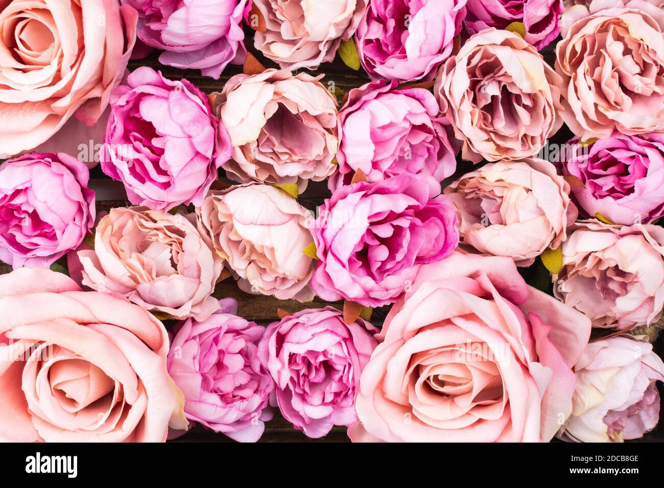 Floral background made of artificial pink roses Stock Photo - Alamy