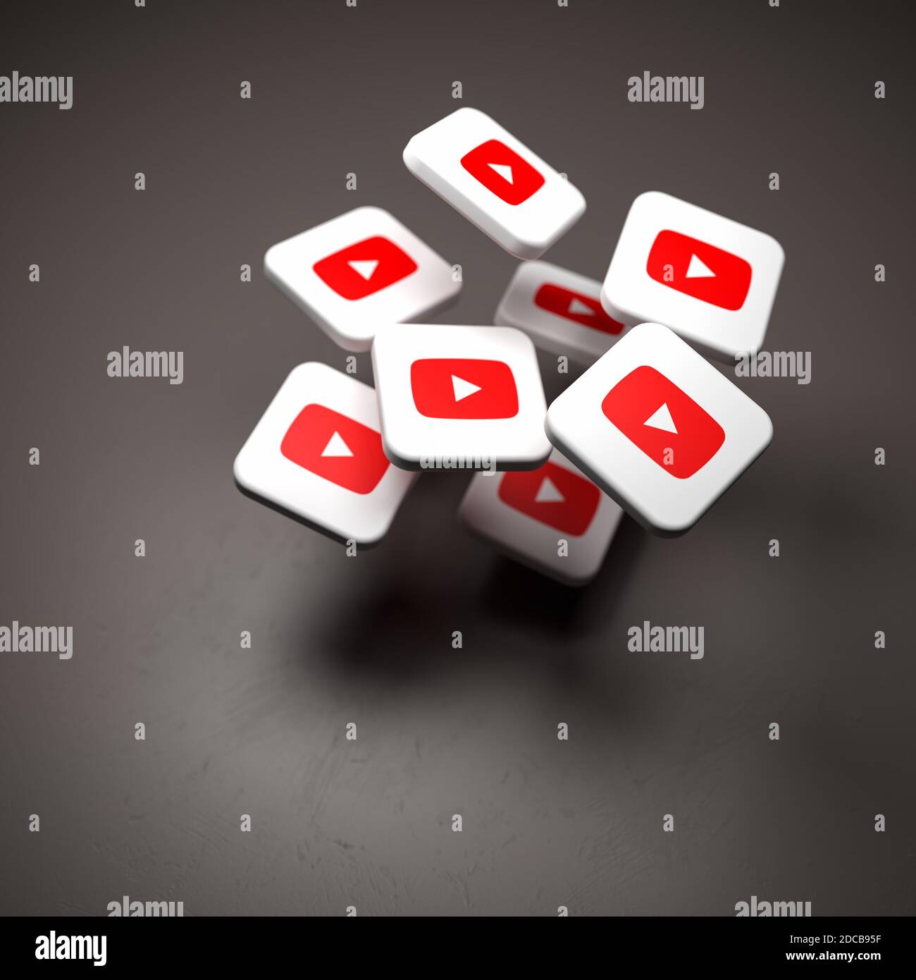 Logos of the social media video site and app Youtube falling onto a ...
