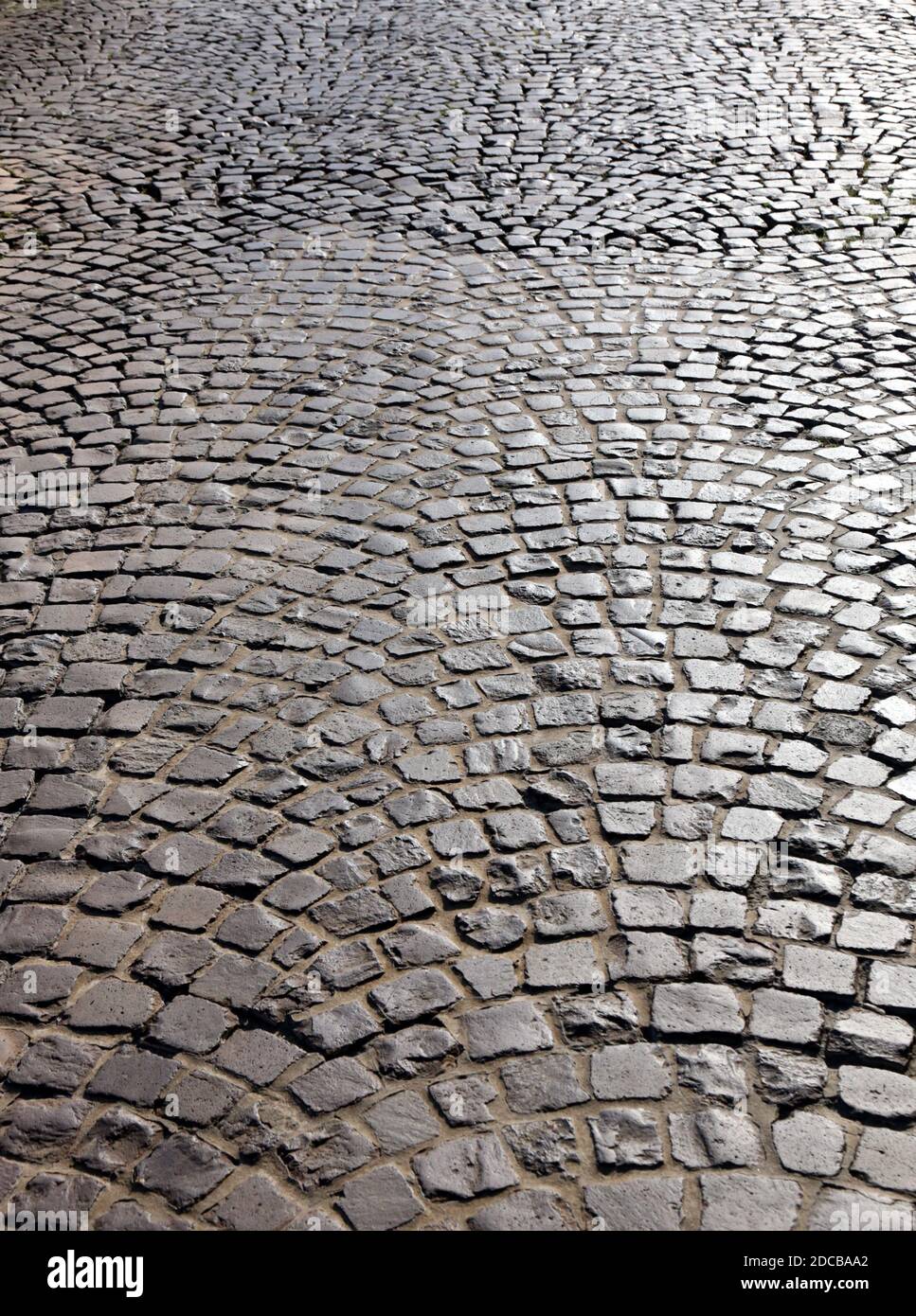 Antique granite cobblestone street pavement. Abstract geometrical ...