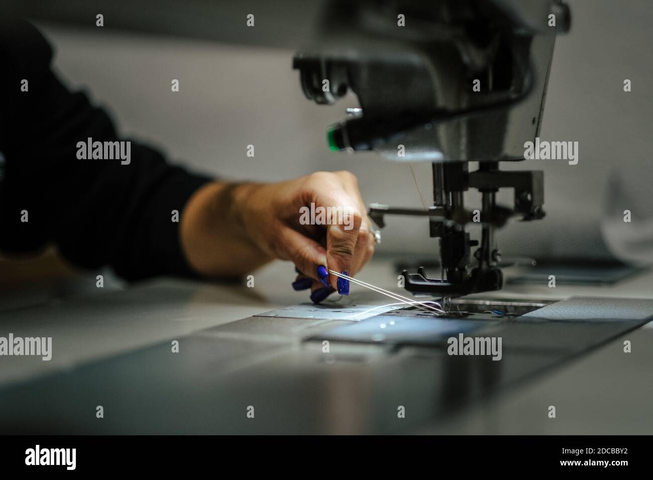 Operating a sewing machine hi-res stock photography and images - Alamy