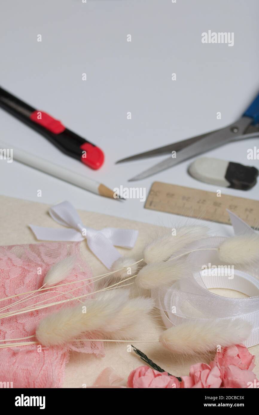 Needlework accessories. Dried flowers and ribbons for crafts. Tools for ...