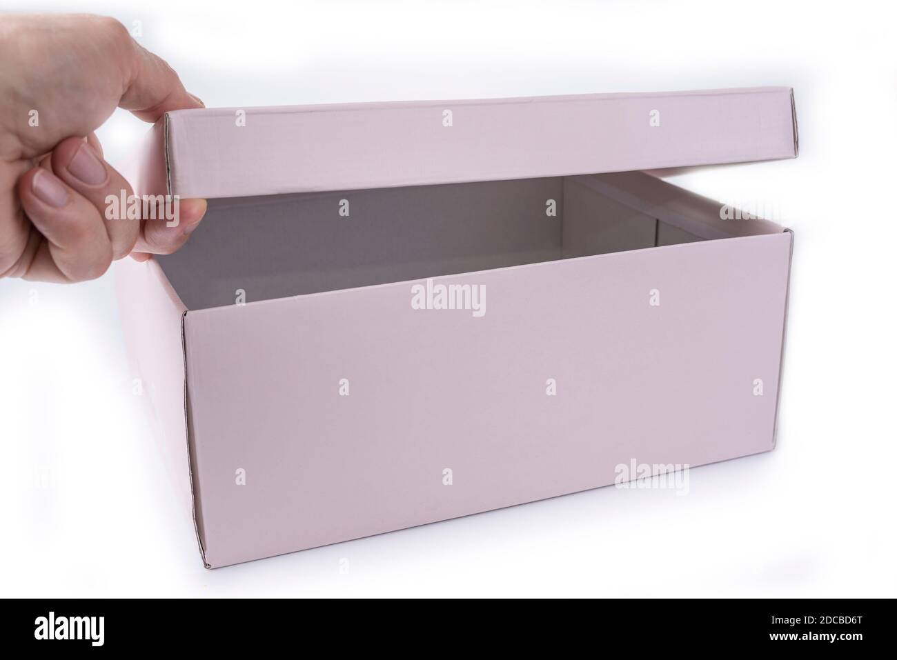 Empty pink paper box with a lid on a white Stock Photo - Alamy