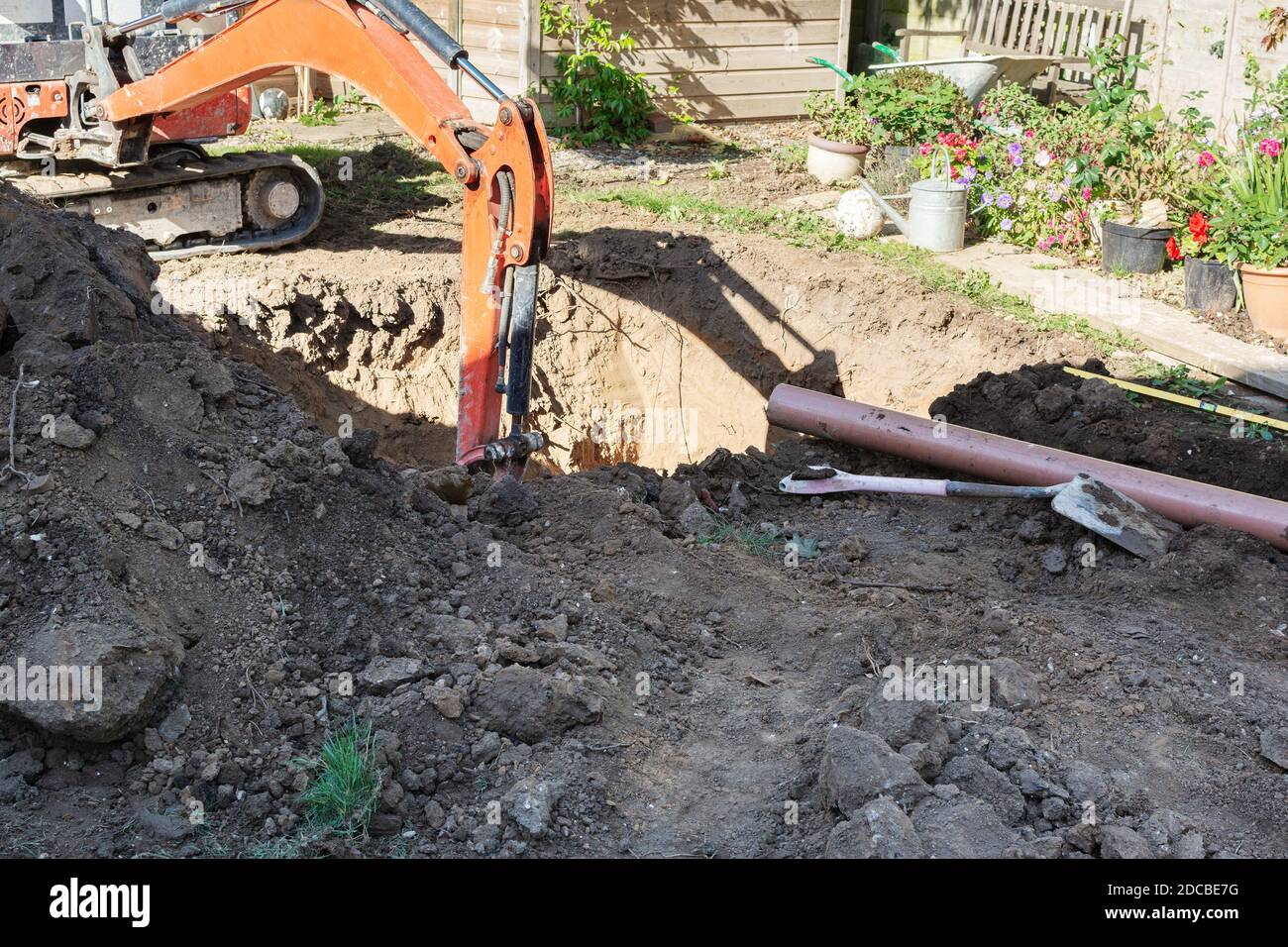 Mini digger hole hi-res stock photography and images - Alamy