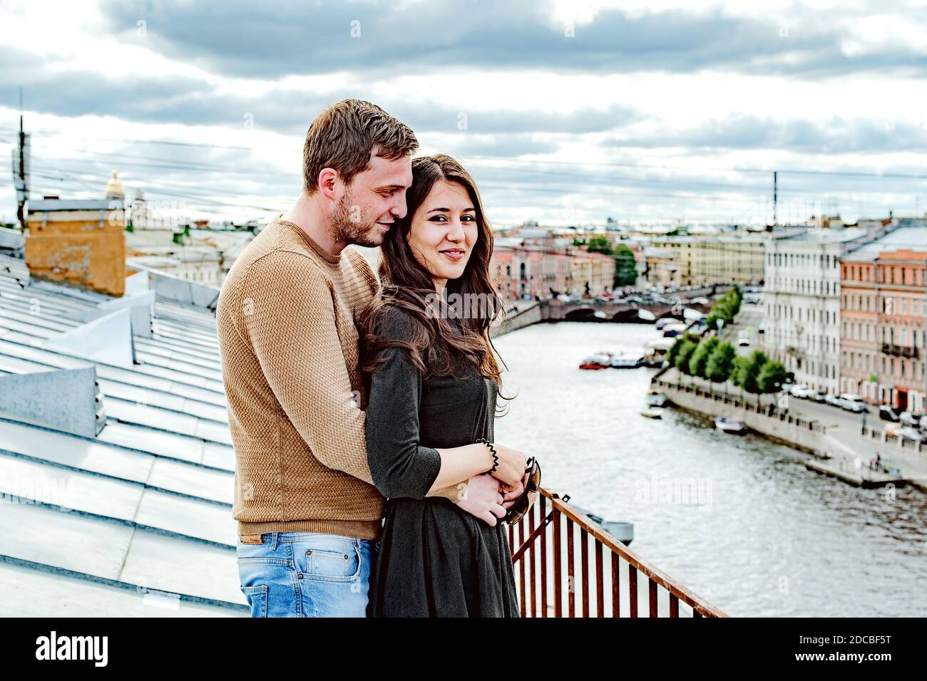 happy couple on the roof of the house Stock Photo - Alamy