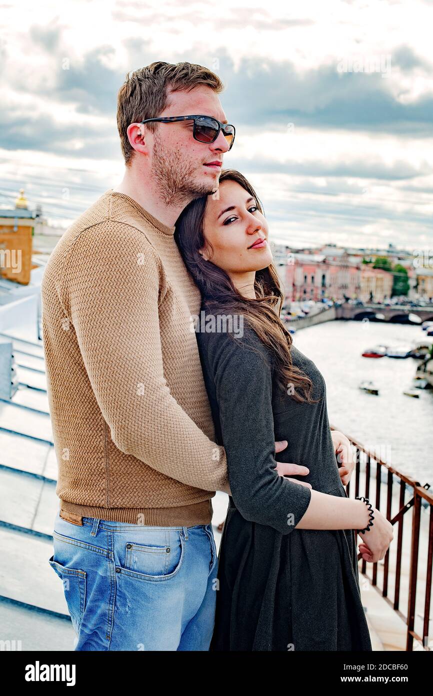happy couple on the roof of the house Stock Photo - Alamy
