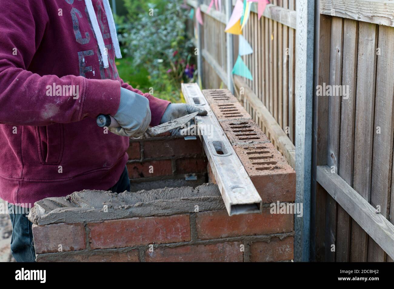 Craftsman man laying blocks hi-res stock photography and images - Alamy