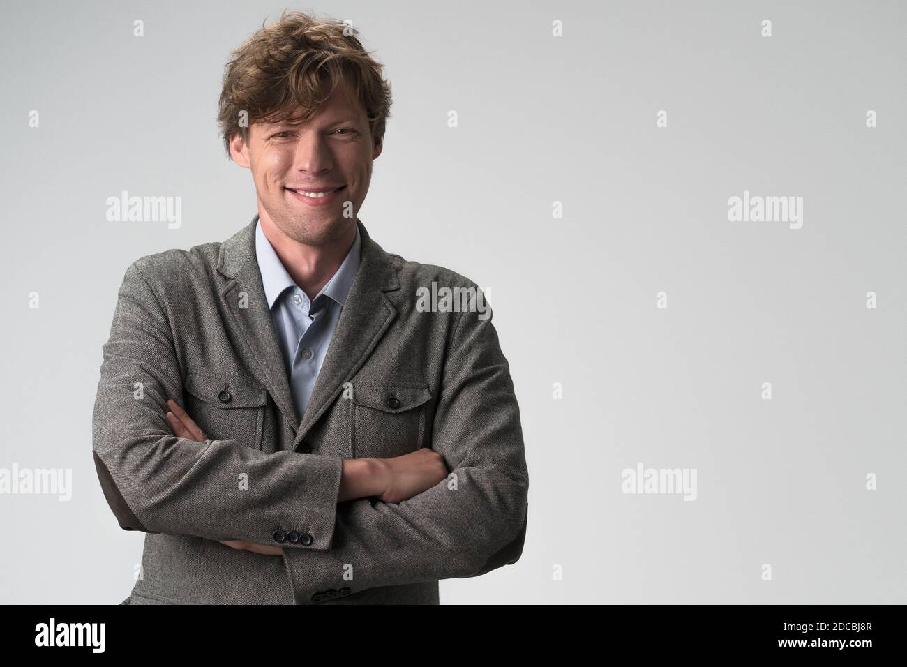 Cheerful businessman folded hands. Handsome confident caucasian wearing ...