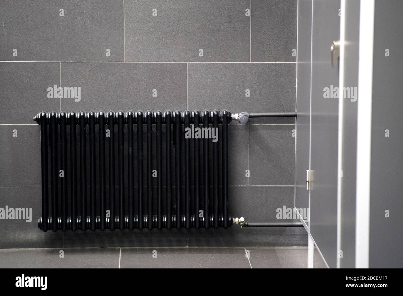 Black radiator, room heater with temperature controller Stock Photo - Alamy