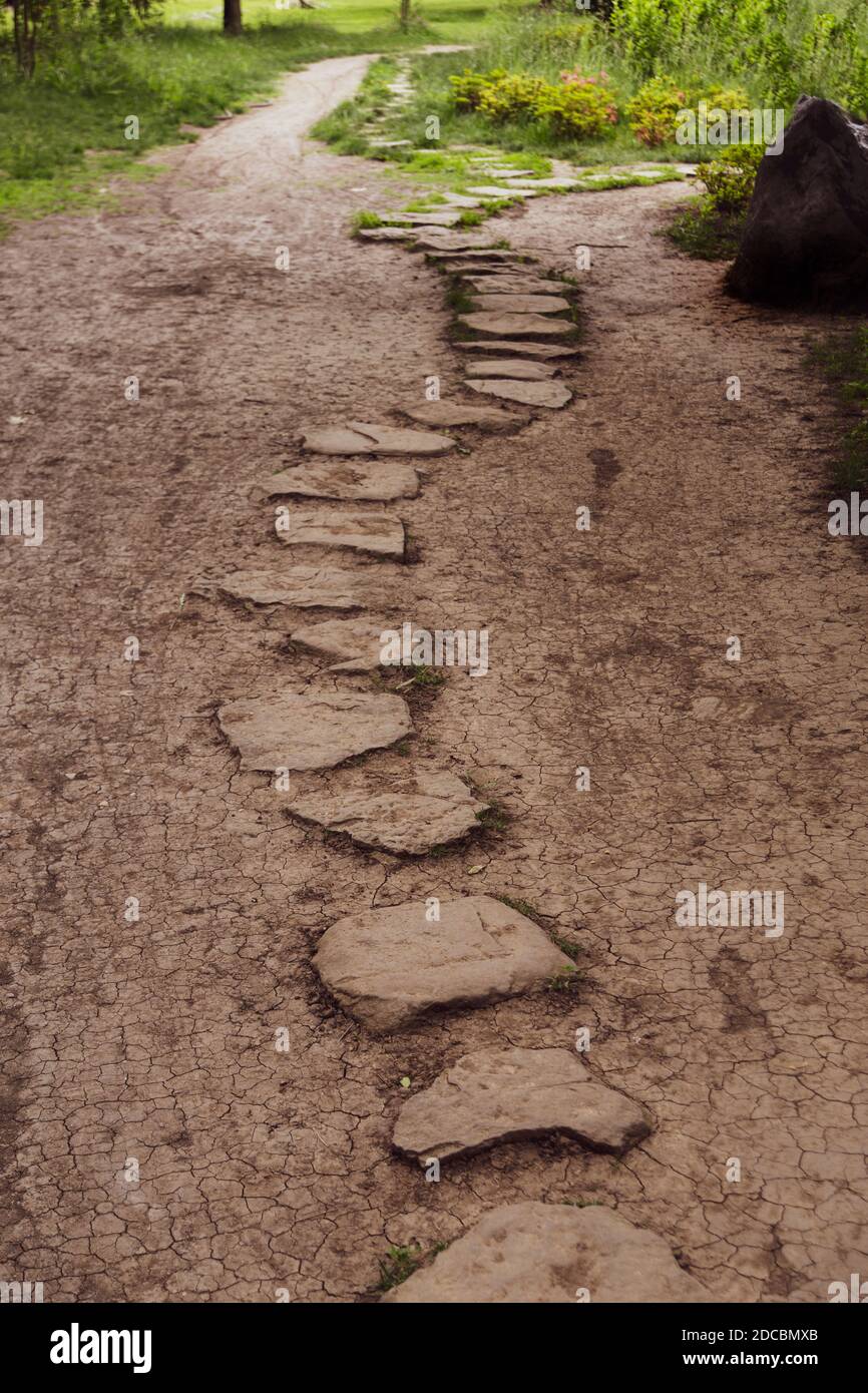 Path of plated stones and sand Stock Photo - Alamy