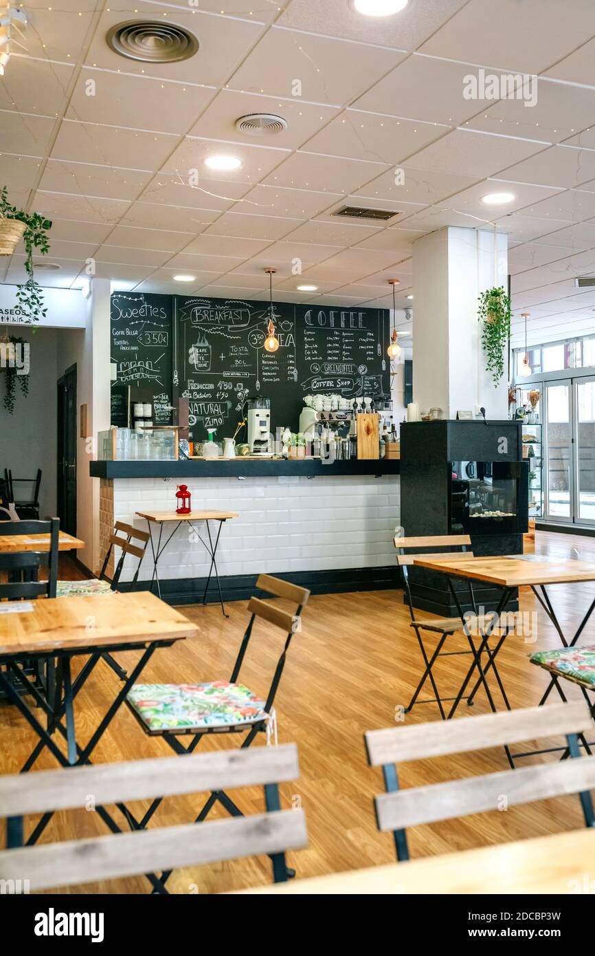 Empty cafe interior with chairs and tables Stock Photo - Alamy