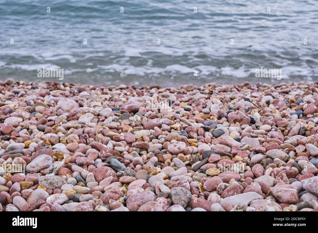 Shingle texture on the sea coast as a background Stock Photo - Alamy