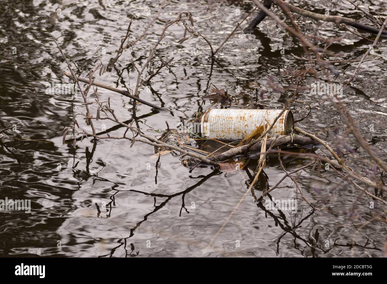 Discarded farming spray can dumped in the river Alwen in rural North ...