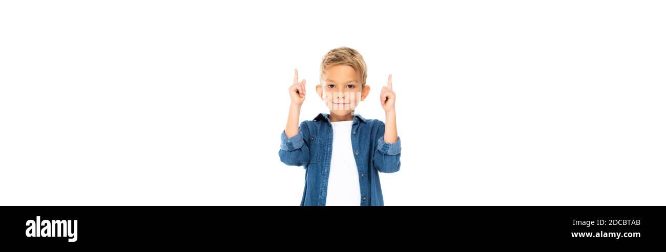 Happy kid pointing up with fingers isolated on white, banner Stock ...