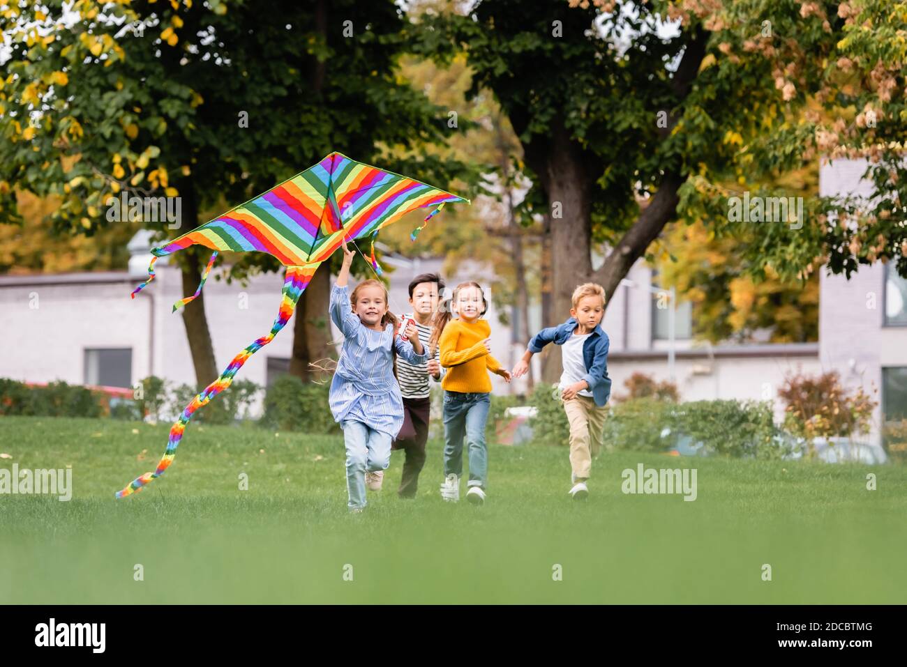 Kids with kite running isolated hi-res stock photography and images - Alamy