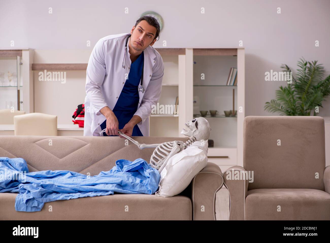 Male paramedic visiting skeleton patient Stock Photo - Alamy