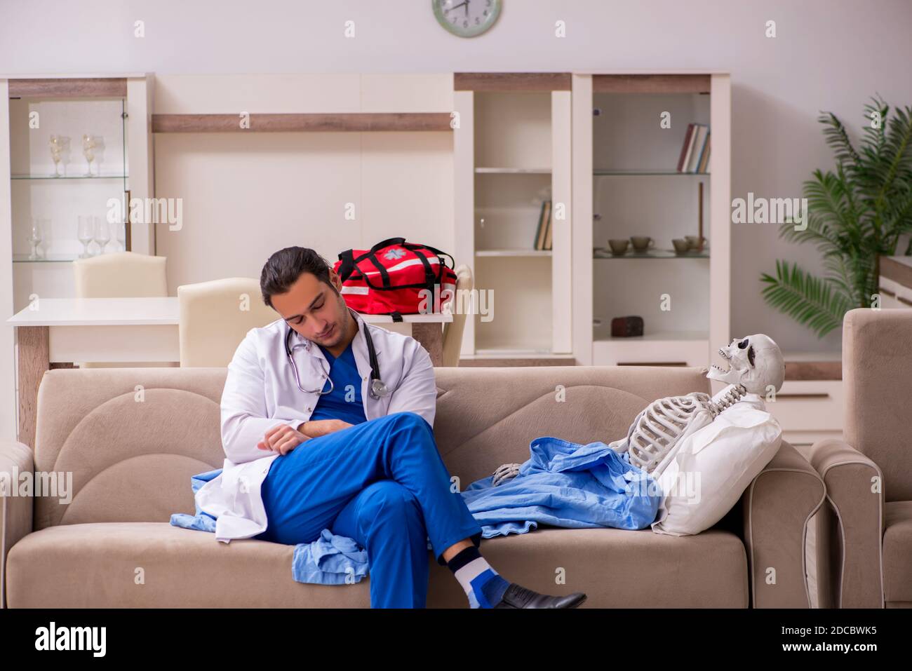 Male paramedic visiting skeleton patient Stock Photo - Alamy