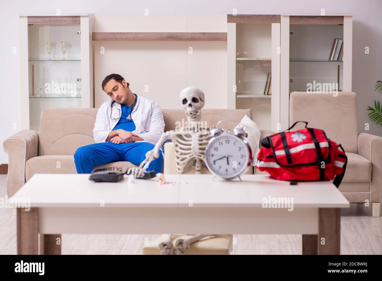 Male paramedic visiting skeleton patient Stock Photo - Alamy