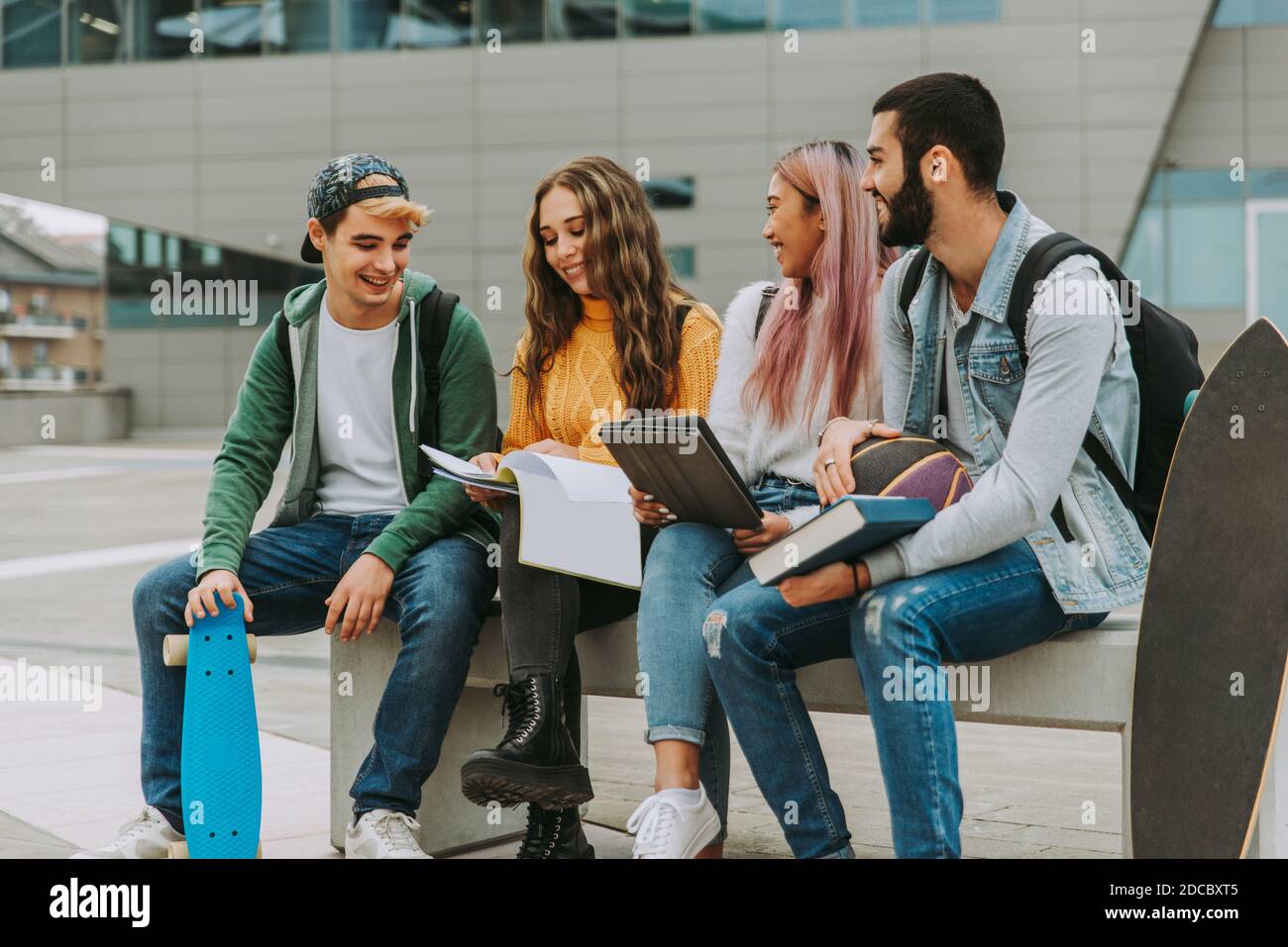 Happy young people meeting outdoors - Group of cheerful teenagers ...