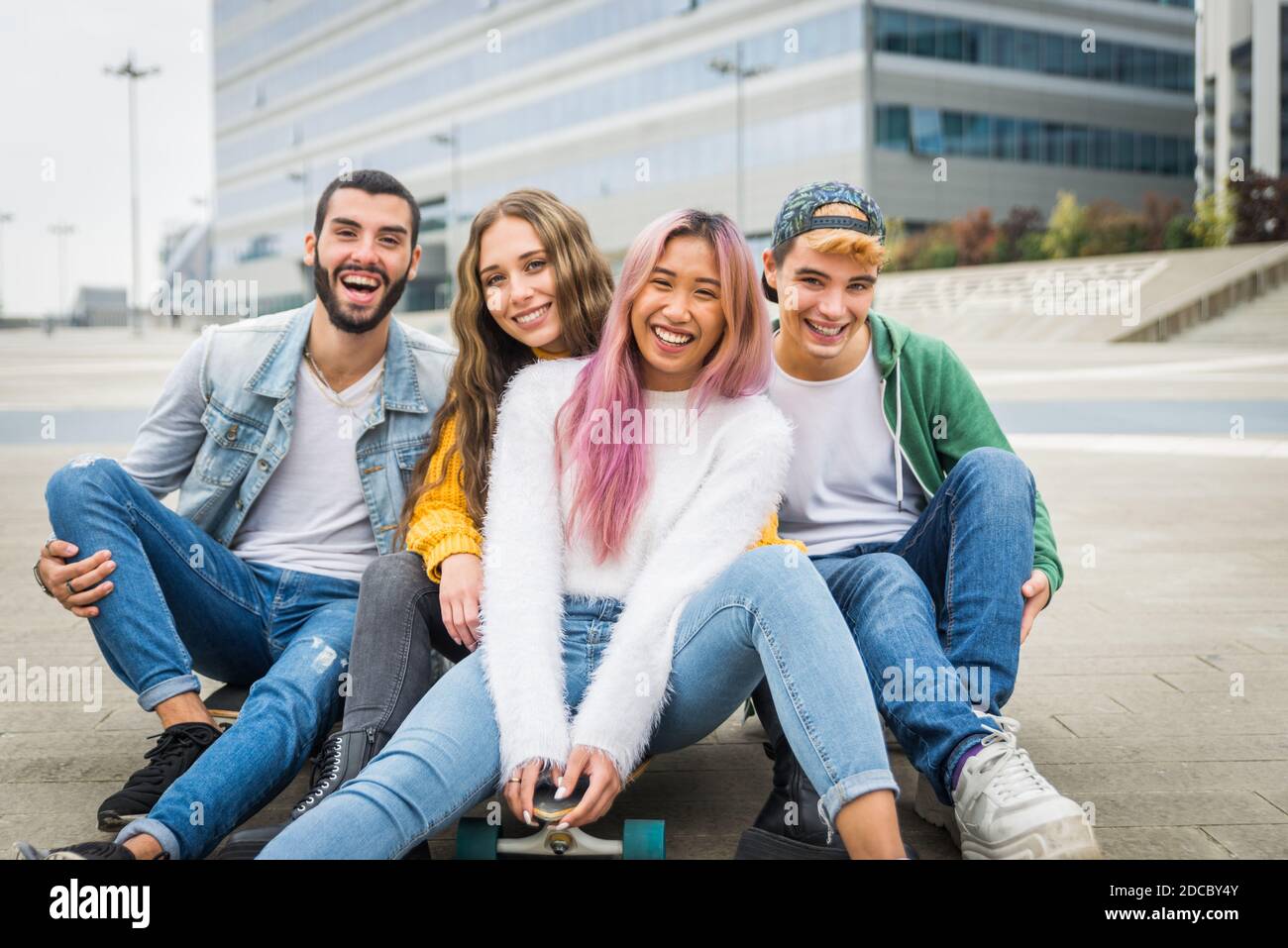 Happy young people meeting outdoors - Group of cheerful teenagers ...