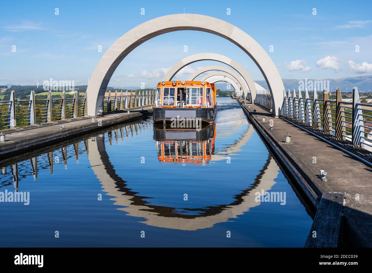 Canal boat on elevated section of canal leaving the top of the Falkirk ...