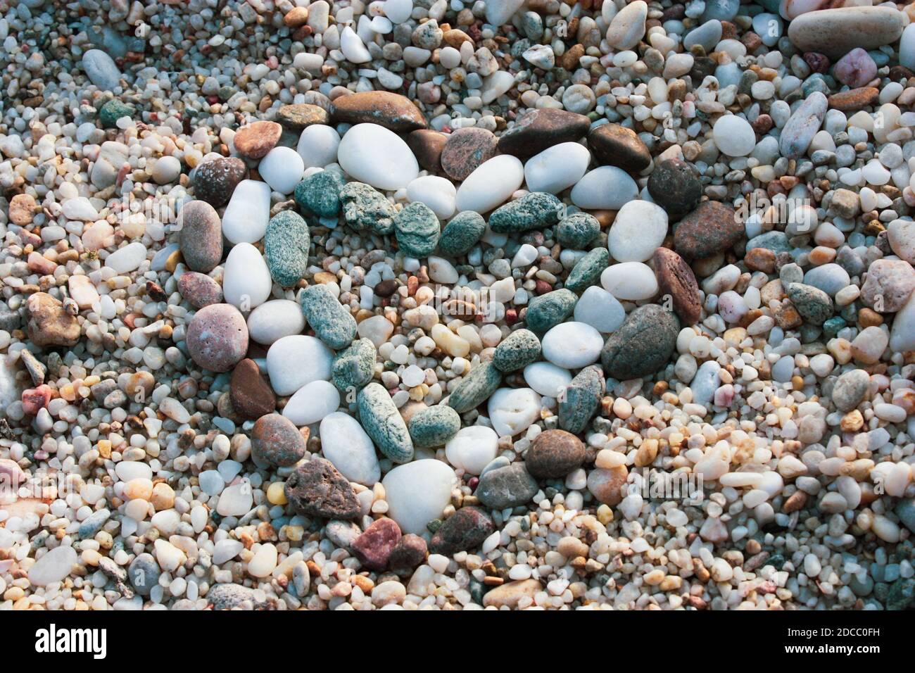 Pebbles in shape of a heart on the beach Stock Photo - Alamy