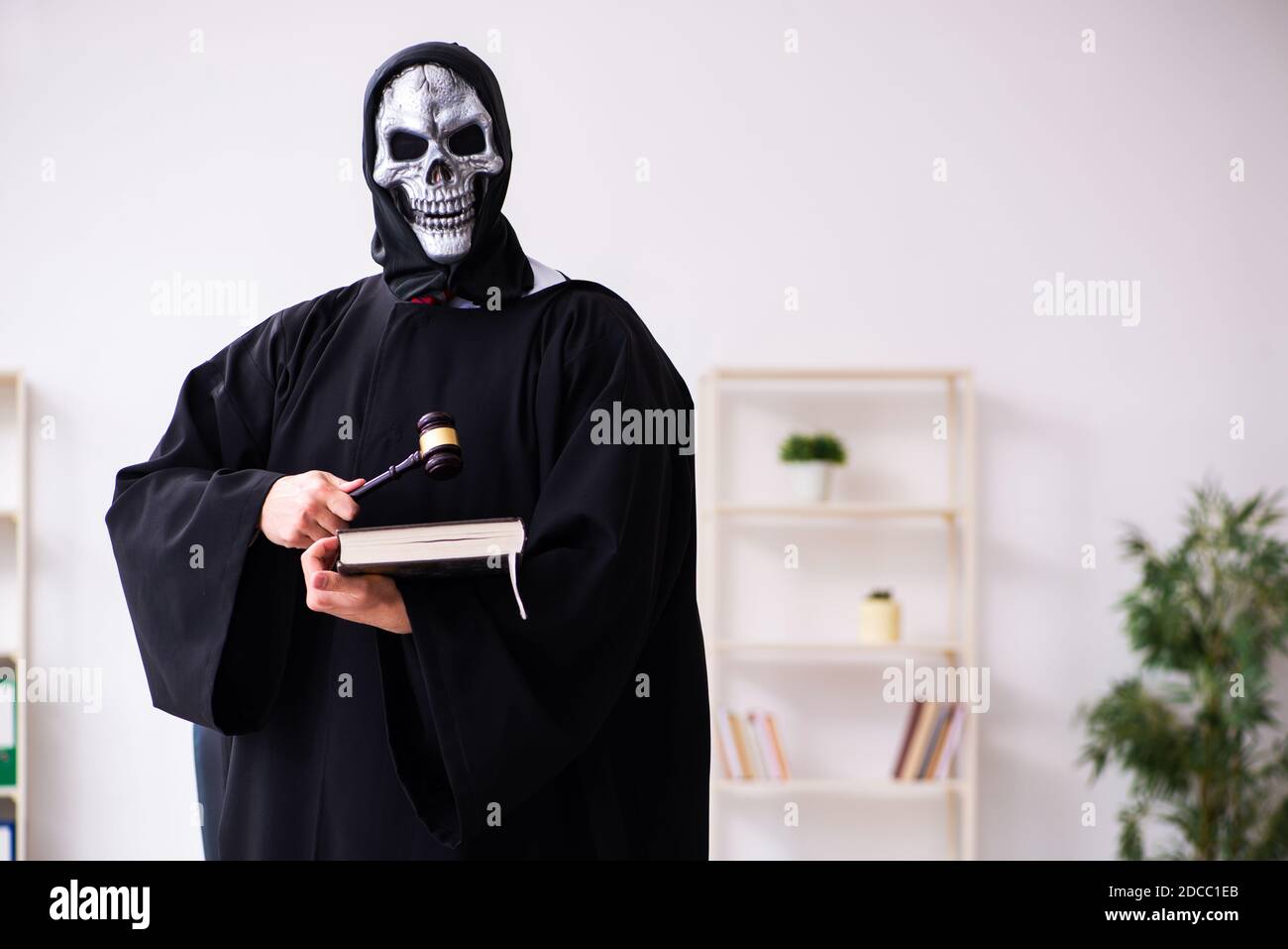 Devil judge working in the courthouse Stock Photo - Alamy