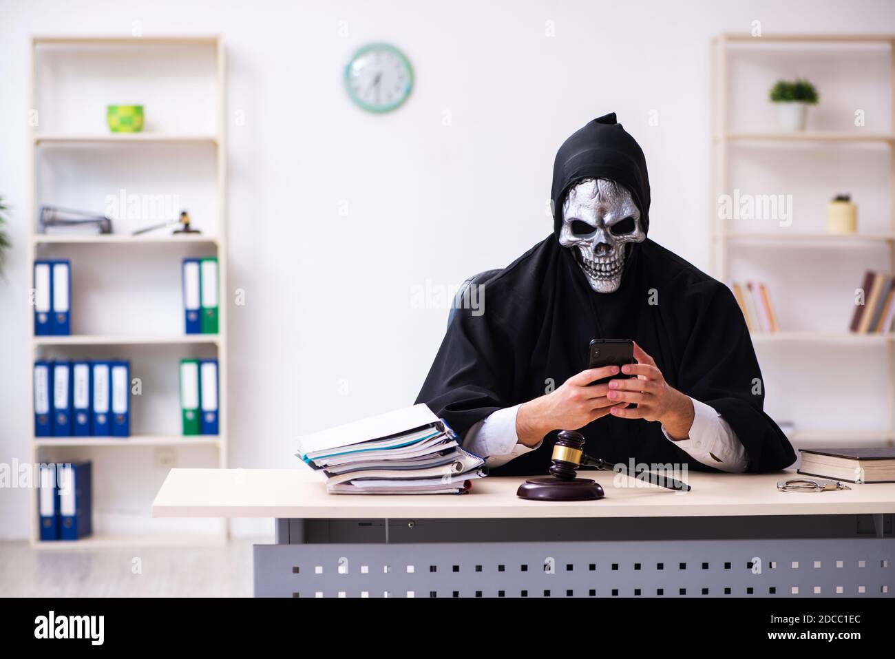 Devil judge working in the courthouse Stock Photo - Alamy
