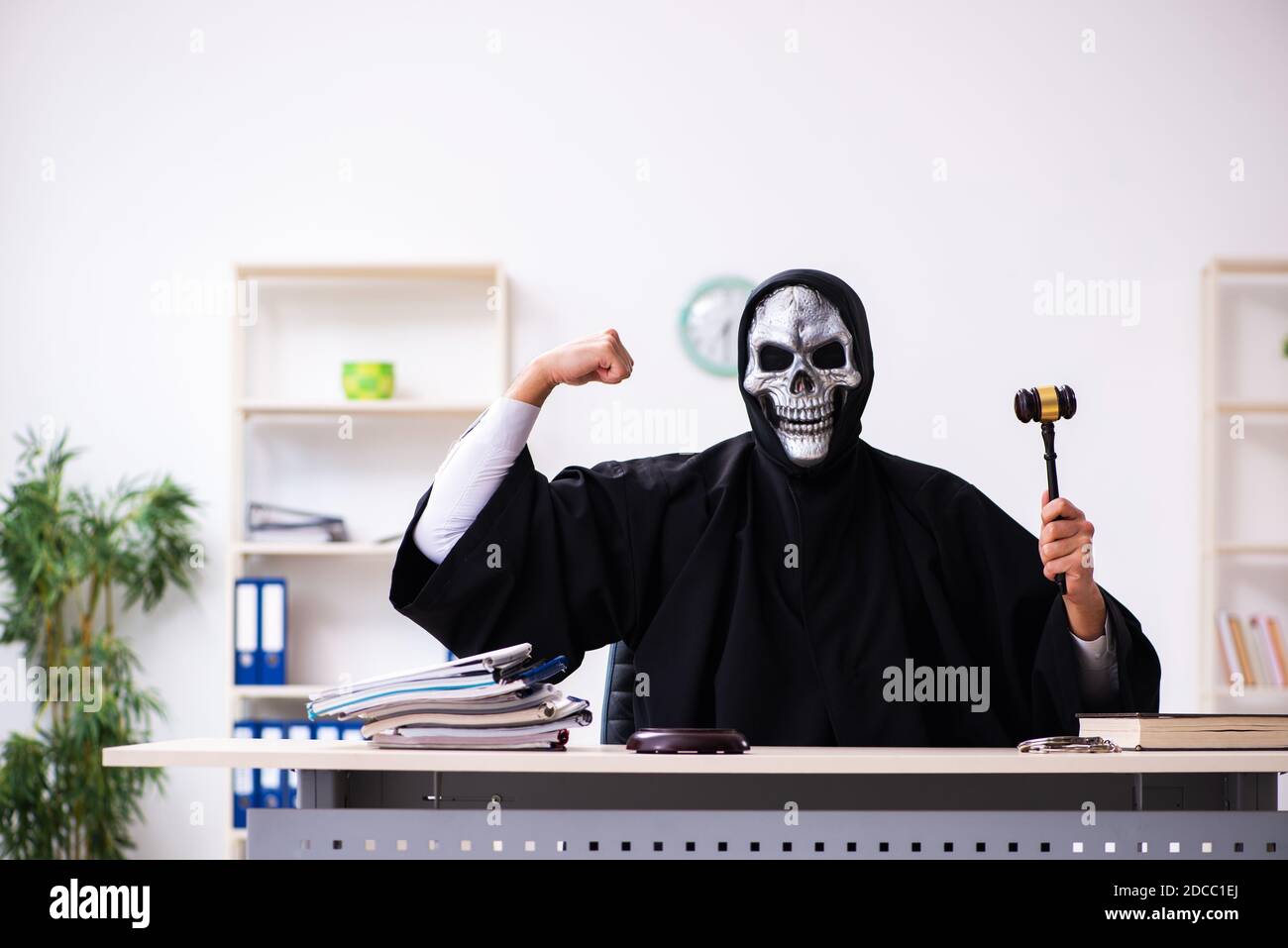 Devil judge working in the courthouse Stock Photo - Alamy