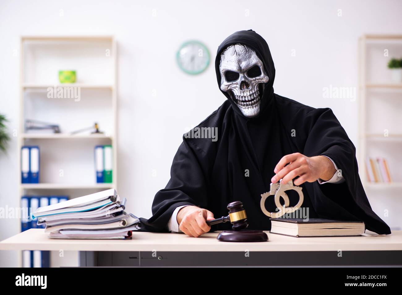 Devil judge working in the courthouse Stock Photo - Alamy