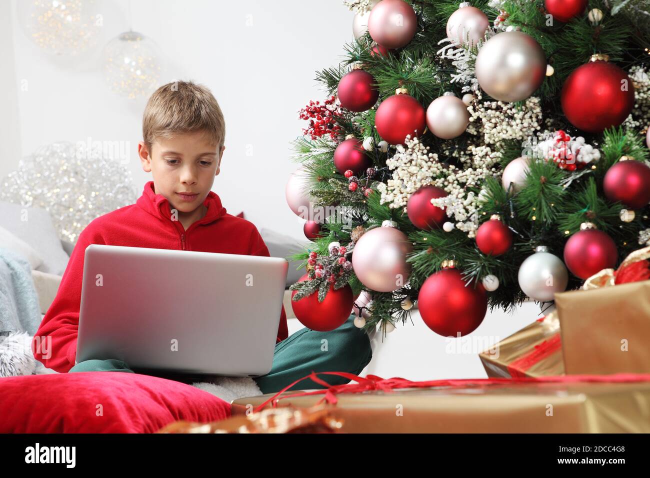 merry christmas and happy holidays, child stay at home with computer ...