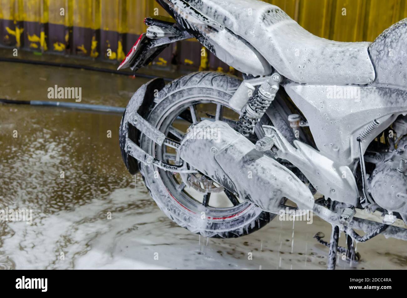 Motorcycle foam wash at the car wash shop cleaning Stock Photo - Alamy