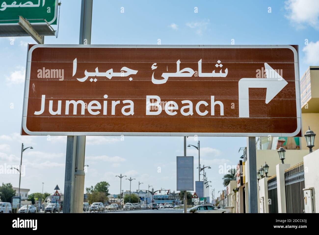 Road sign of Jumeirah Beach in English and Arabian language, a famous ...