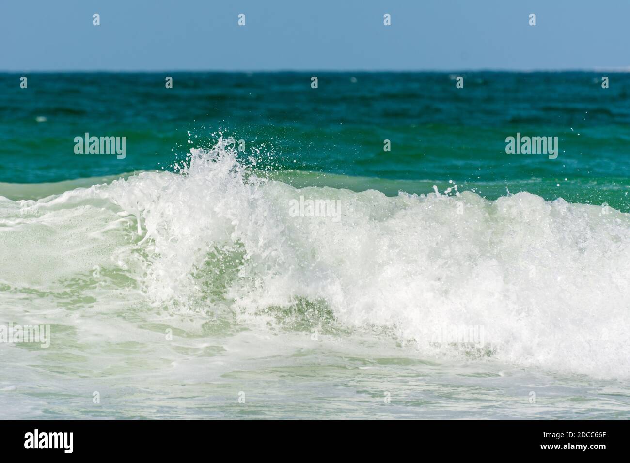 Waves, water splash flushing beach at Jumeirah beach at Persian gulf in ...
