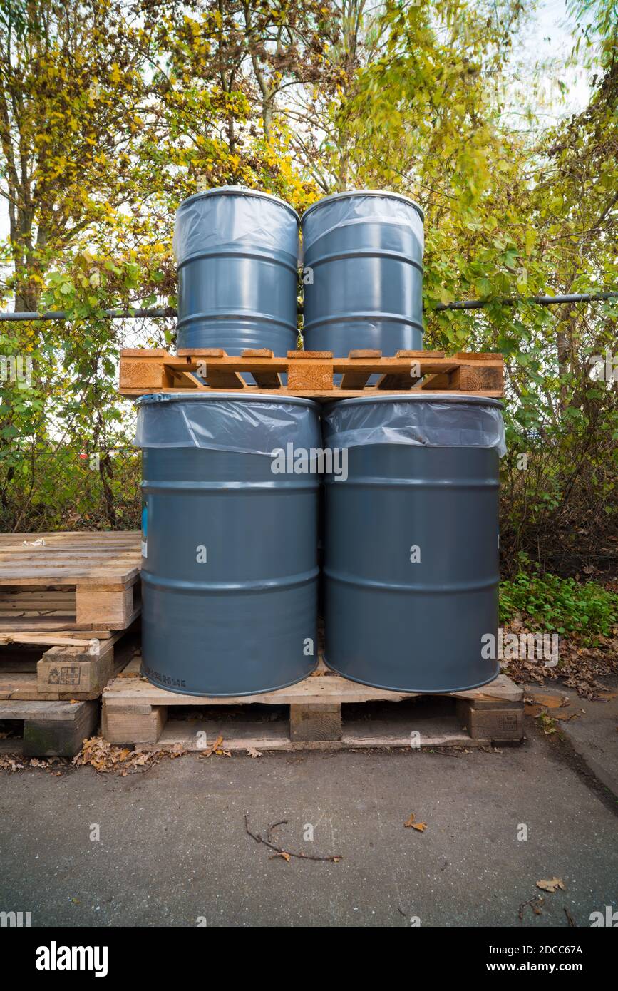 storage of empty oil barrels at a factory Stock Photo - Alamy