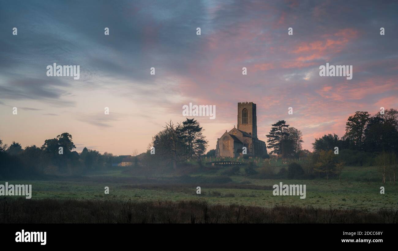 Dawn sky over Swanton Morley church on a misty Autumn morning Stock ...