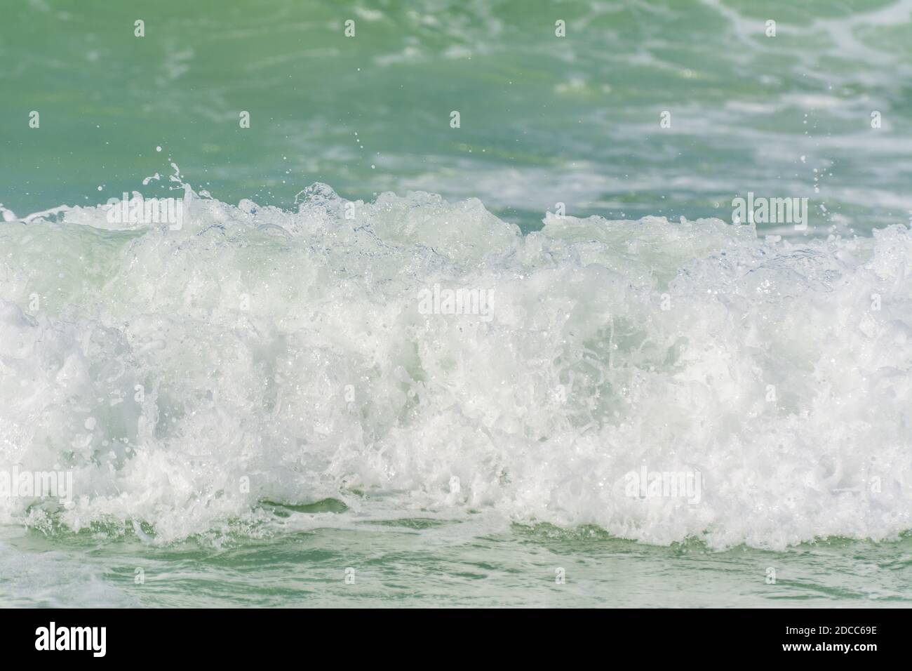 Waves, water splash flushing beach at Jumeirah beach at Persian gulf in ...