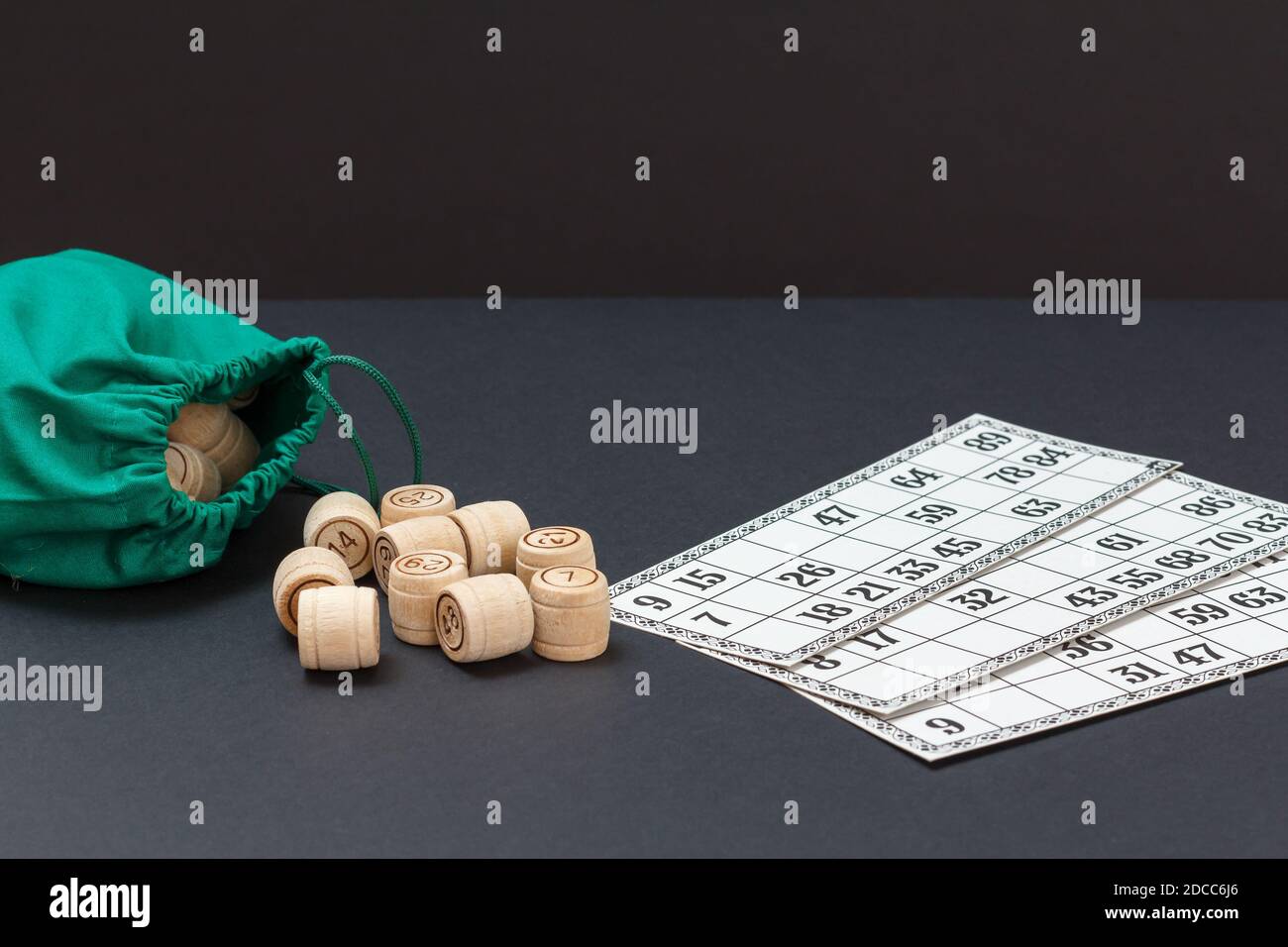 Board game lotto. Wooden lotto barrels with a green closed bag and game ...