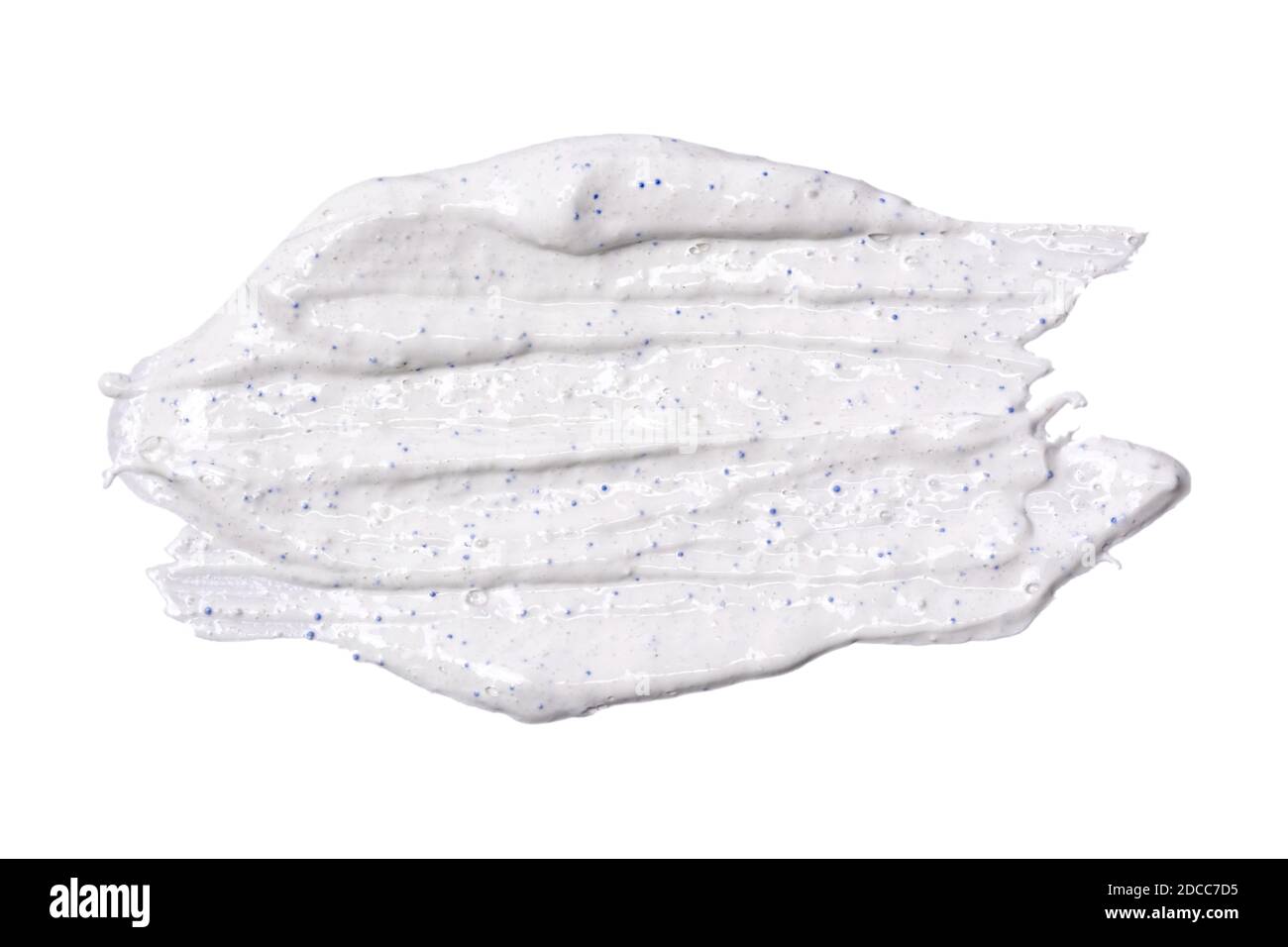 White clay face mask smear isolated on white. Microparticles in ...