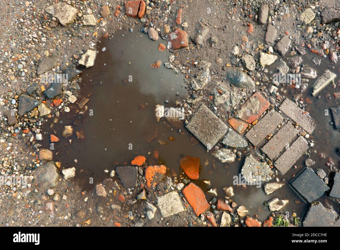 Very bad road conditions, a road surface consisting of rubble and mud ...