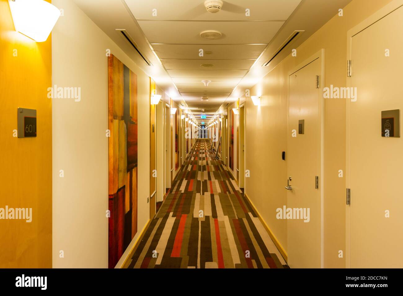 Golden corridor with carpet and closed doors at the hotel Stock Photo ...
