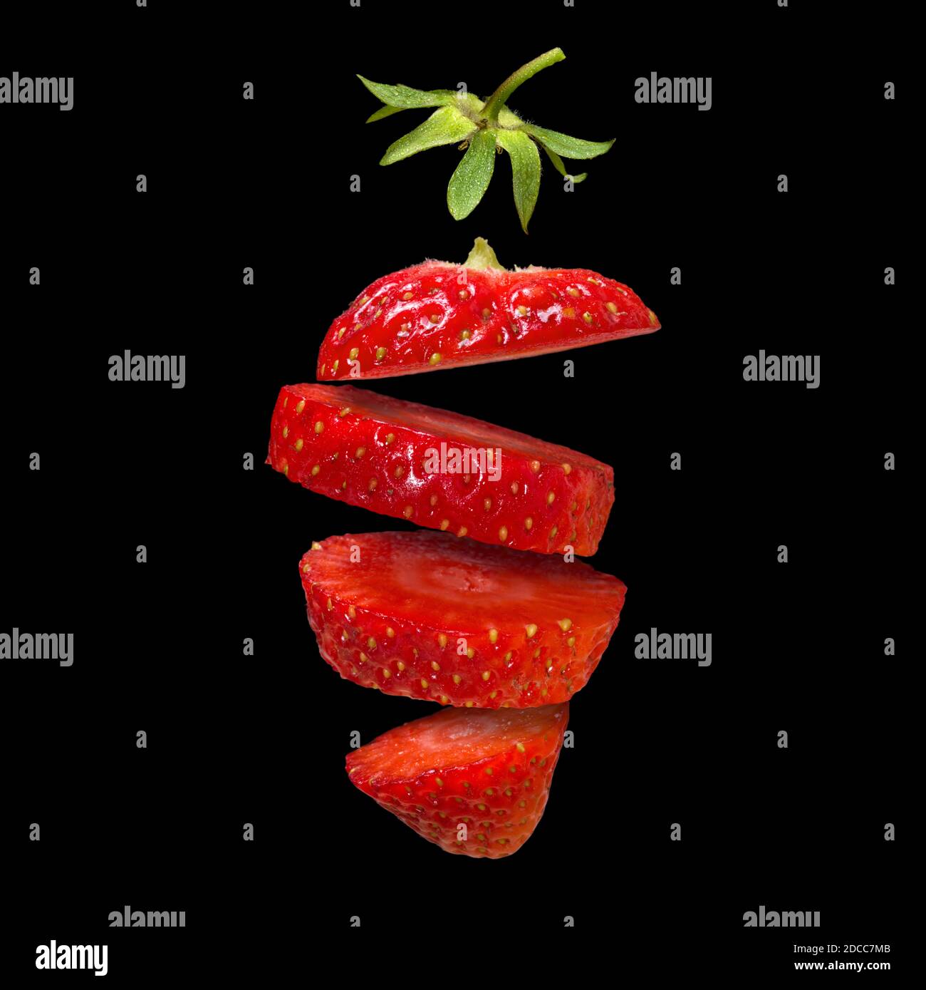 Strawberry slices isolated on black background. Surreal design. Pieces ...
