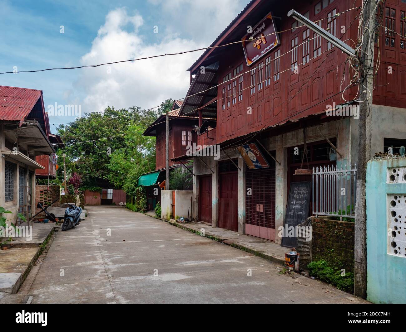 Local street with traditional, wooden houses in Myeik, Tanintharyi ...