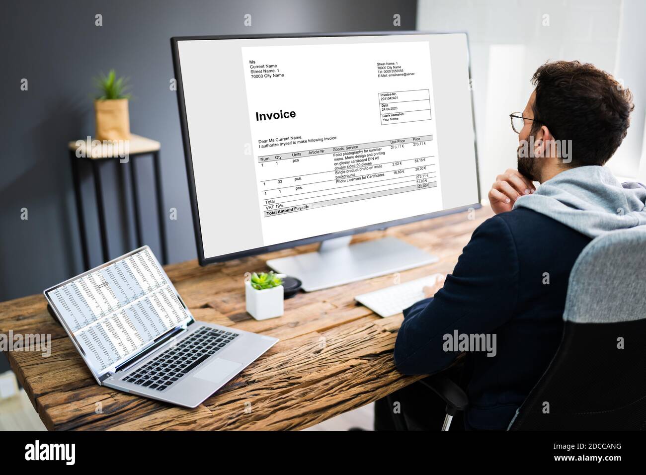 E Invoice Computer Audit On Multiple Screens Stock Photo - Alamy