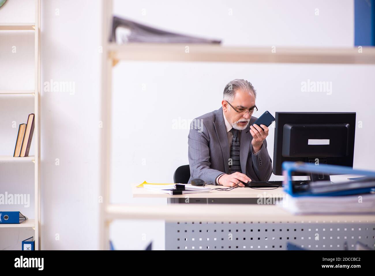 Businessman angry and furious at his workplace Stock Photo - Alamy