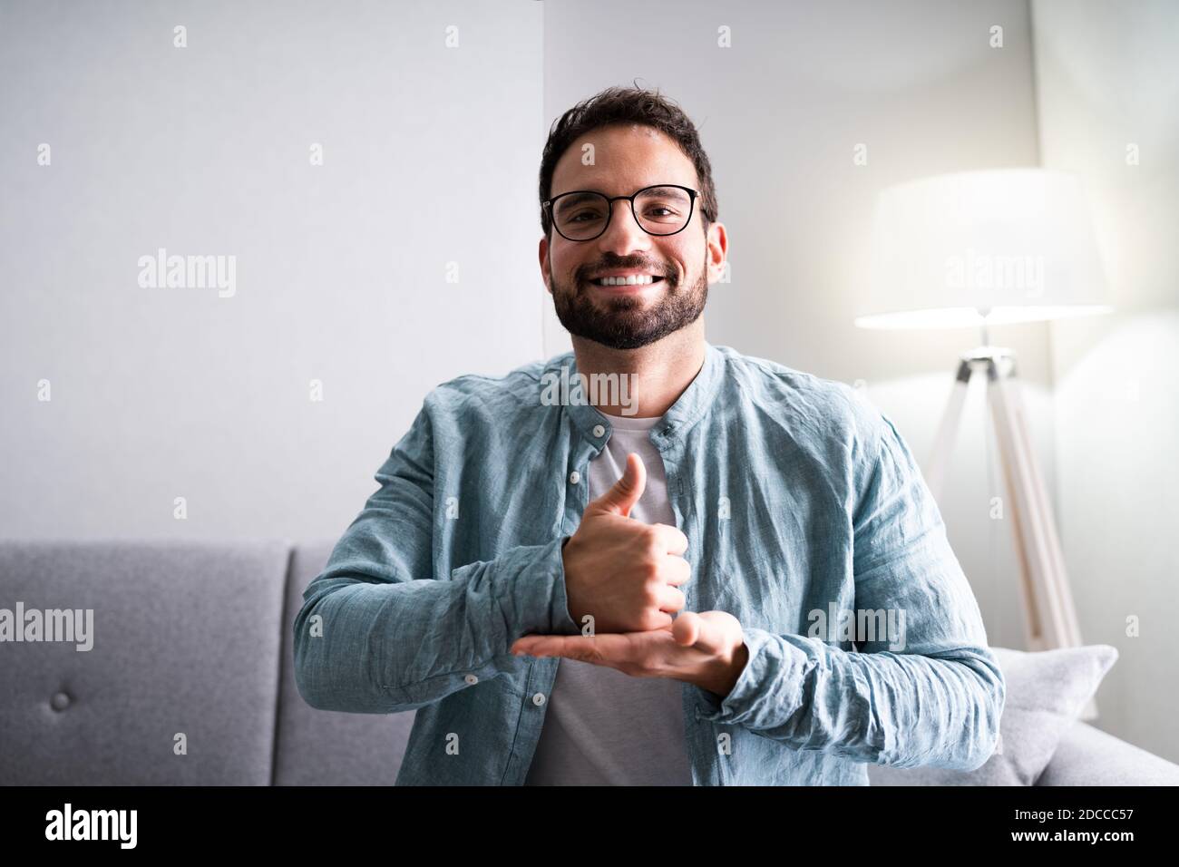 Adult Learning Sign Language For Deaf Disabled Stock Photo - Alamy